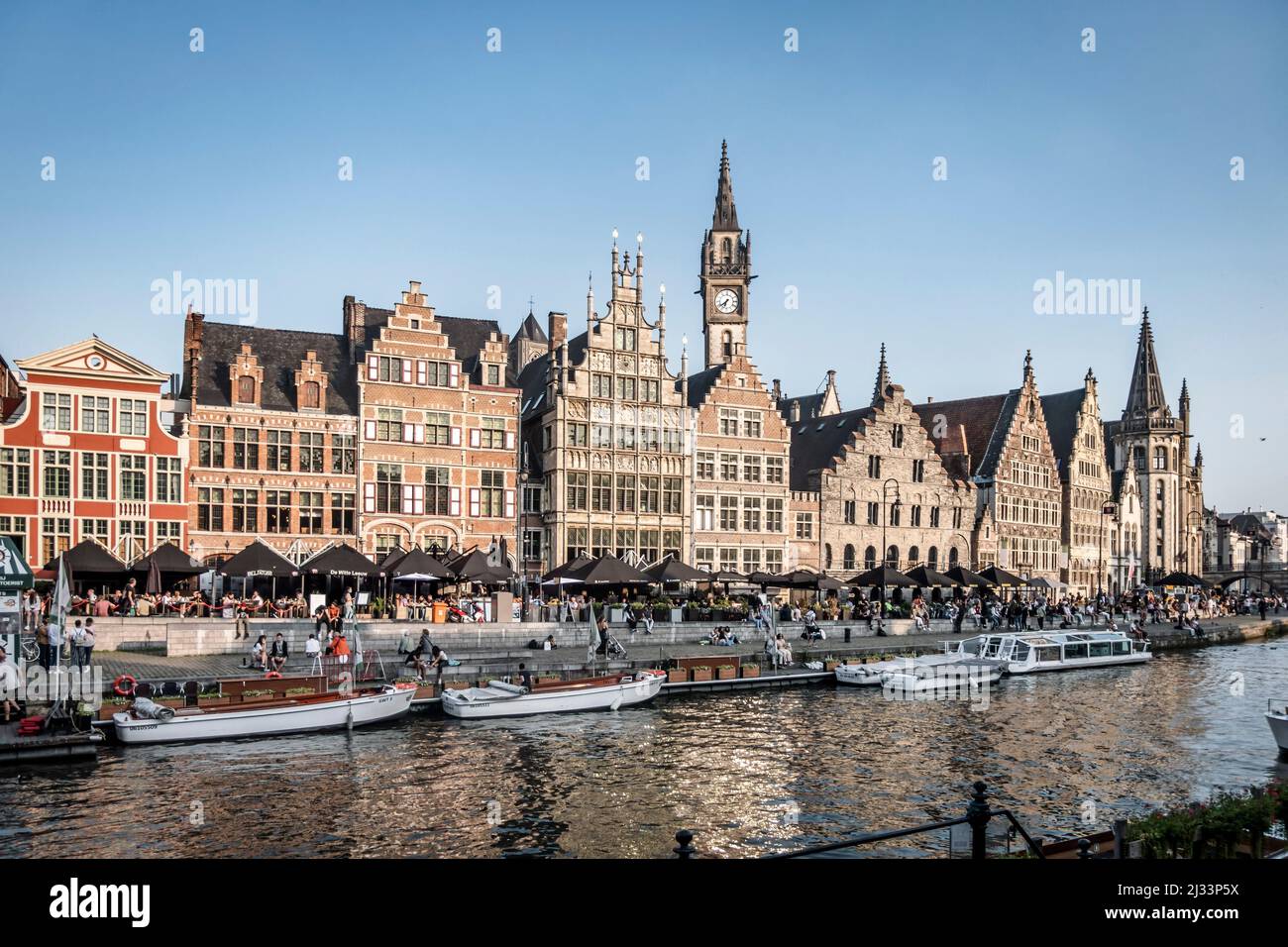 Tourist boat on the river Leie, Ganslei quay, town hall of the Vrije ...