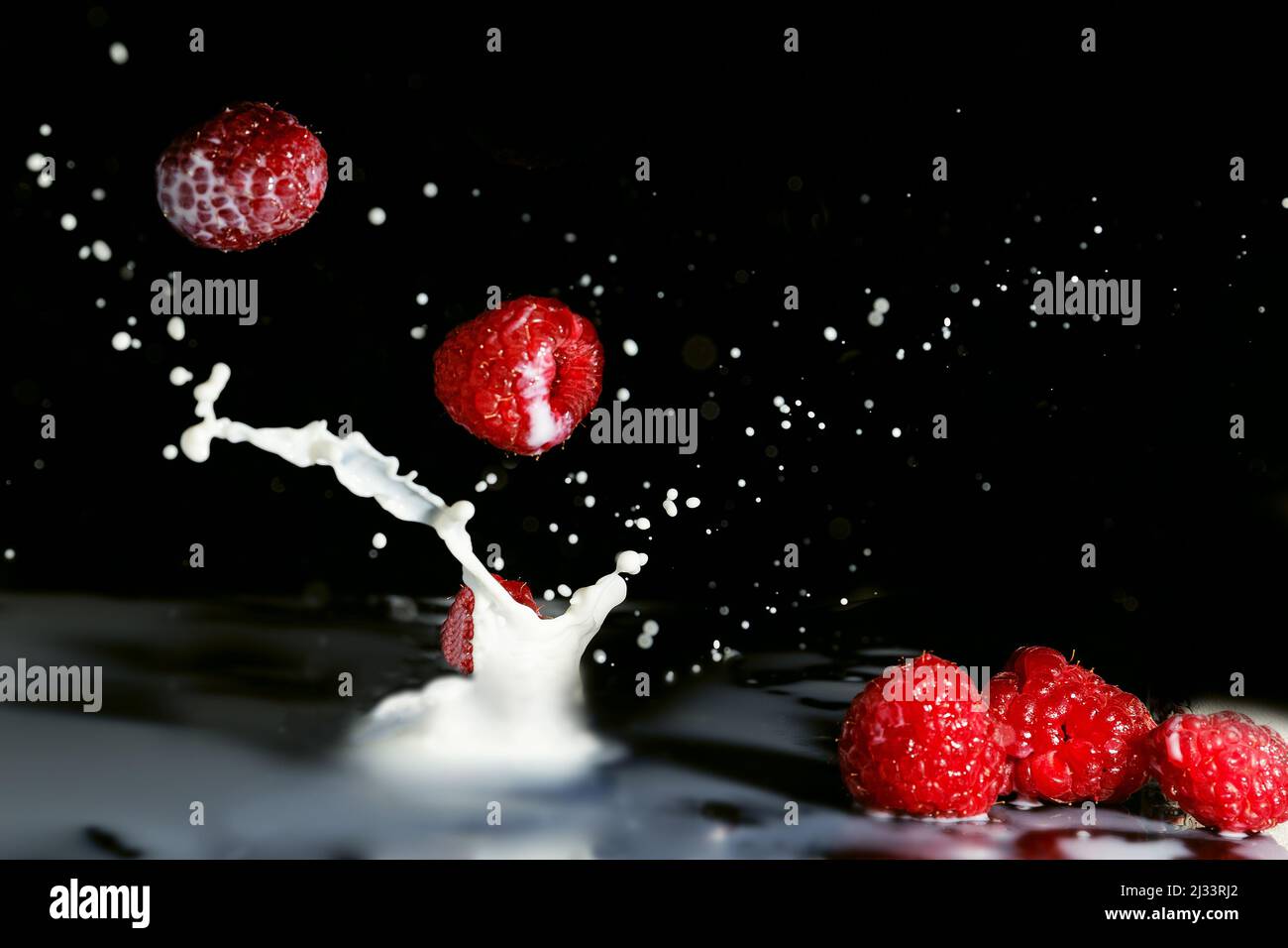Fruit in milk. Levitation, splashes, black background, isolate Stock ...