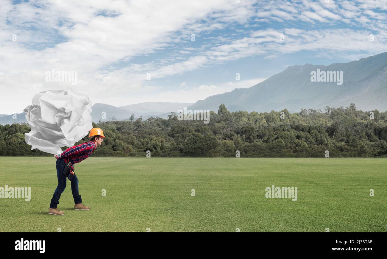 Engineer man carry load Stock Photo - Alamy