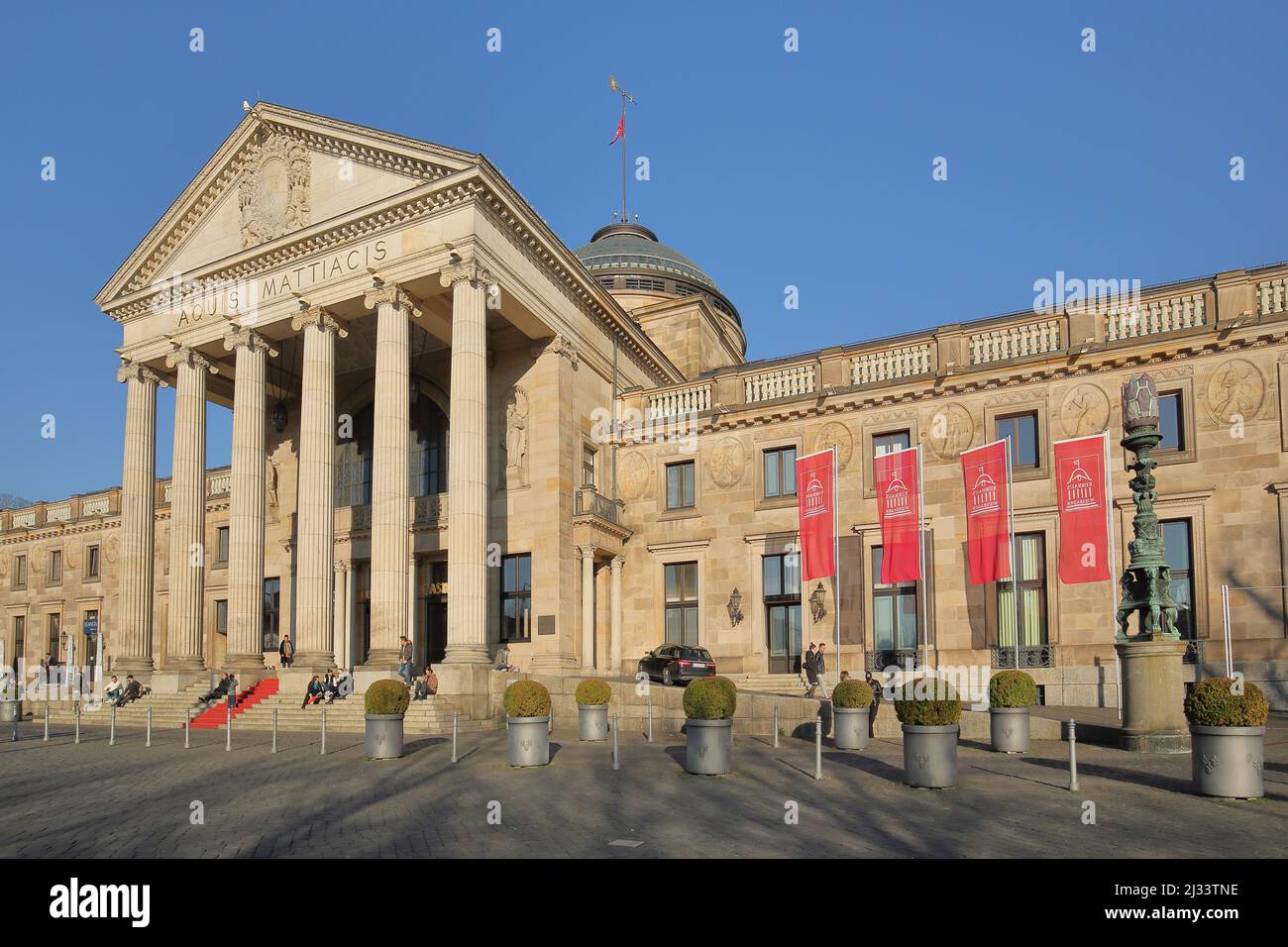 Neoclassical Kurhaus with city flags in Wiesbaden, Hesse, Germany Stock ...