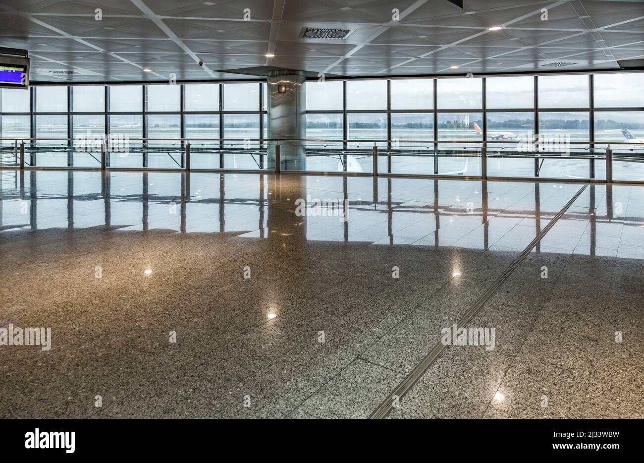MADRID, SPAIN - DEC 21, 2010: modern new departure hall with window in ...