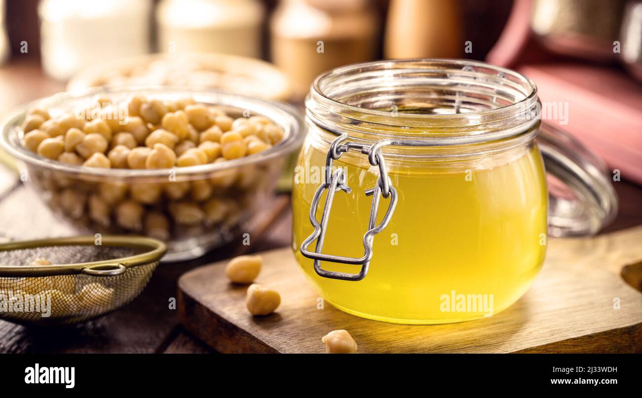 aquafaba in a kitchen pot, compote with organic chickpea legume water ...