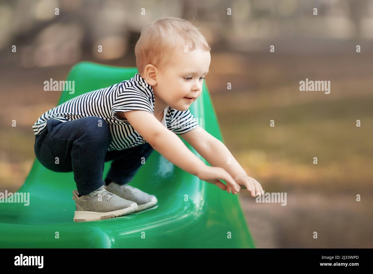 Little boy sports training her balance on chair edge Stock Photo - Alamy