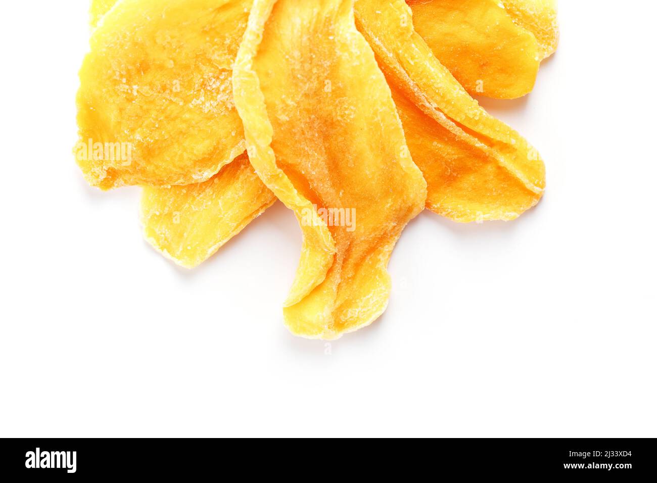 Dried sweet mango fruit slices as textural orange background in full ...
