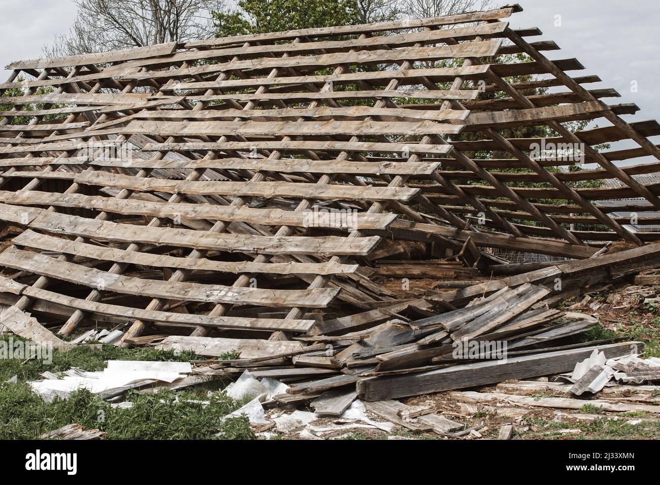 Old ruined house with a holey roof. Removed slate roof tiles on a ...