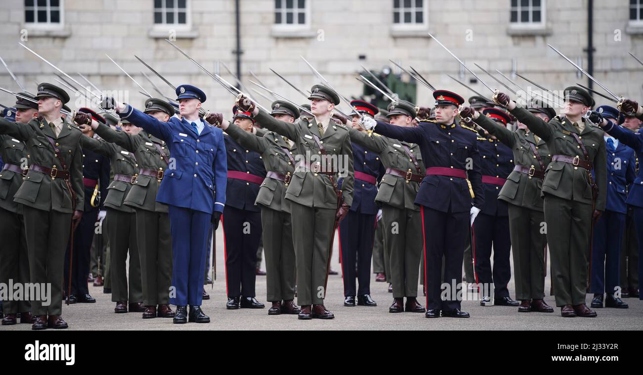 Newly commissioned officers salute during the Commissioning Ceremony of ...