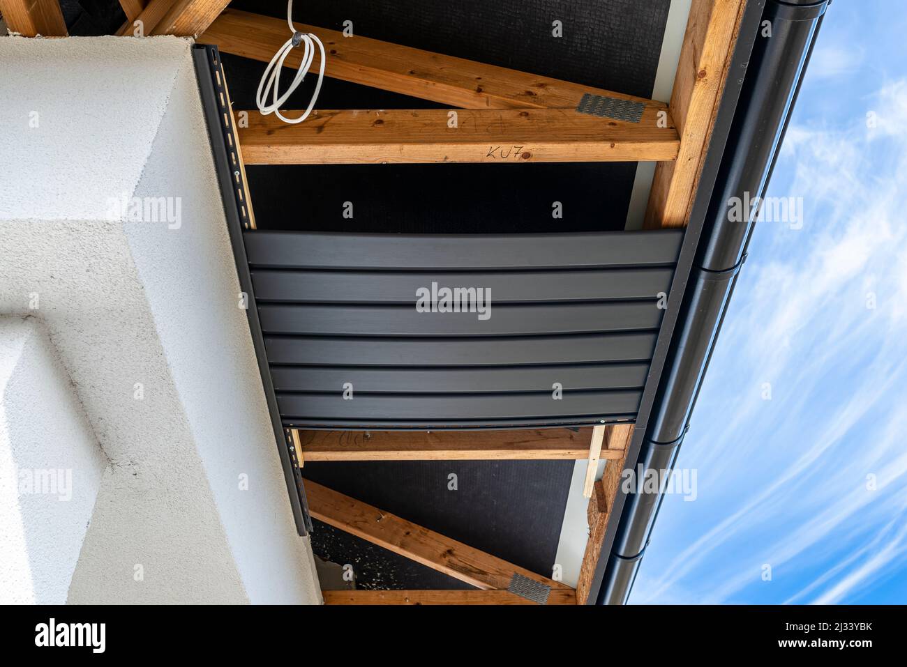 The soffit is attached to the trusses without proper support, bent in ...