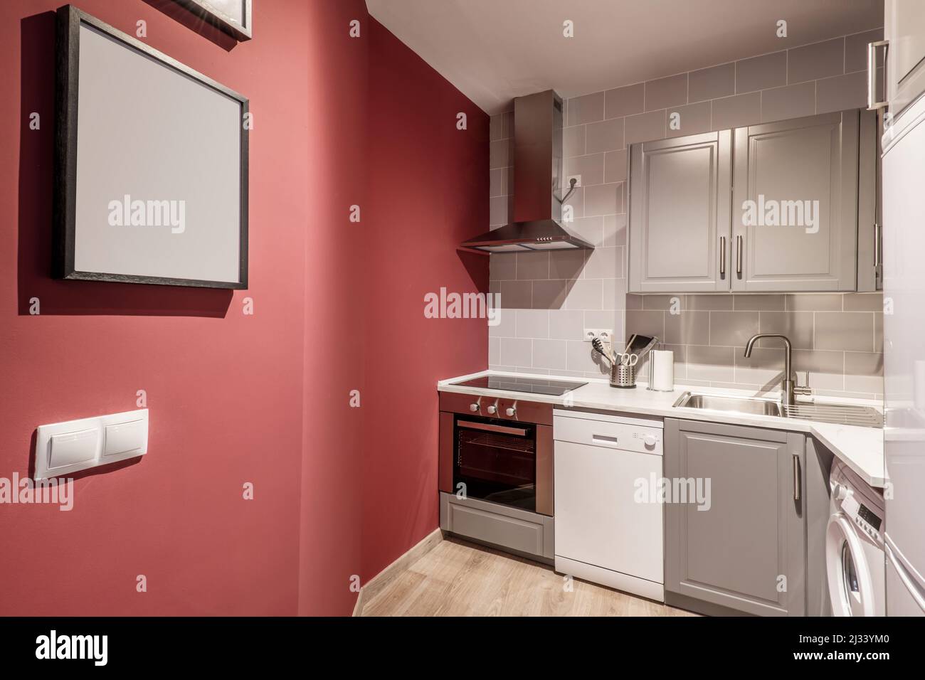 Open kitchen with white appliances, dishwasher, washing machine and ...