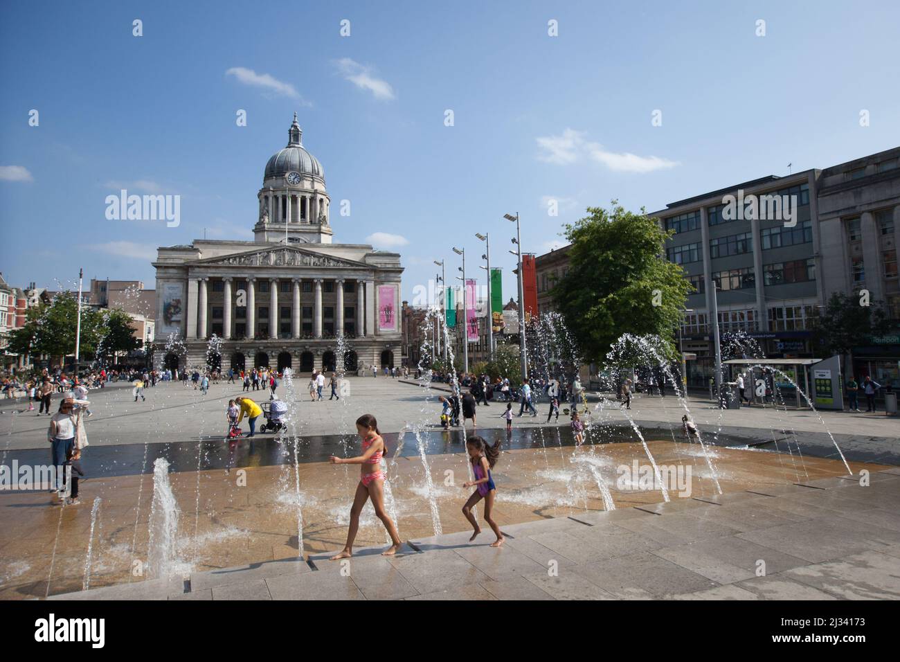Children playing in the water fountain at Old Market Square in ...