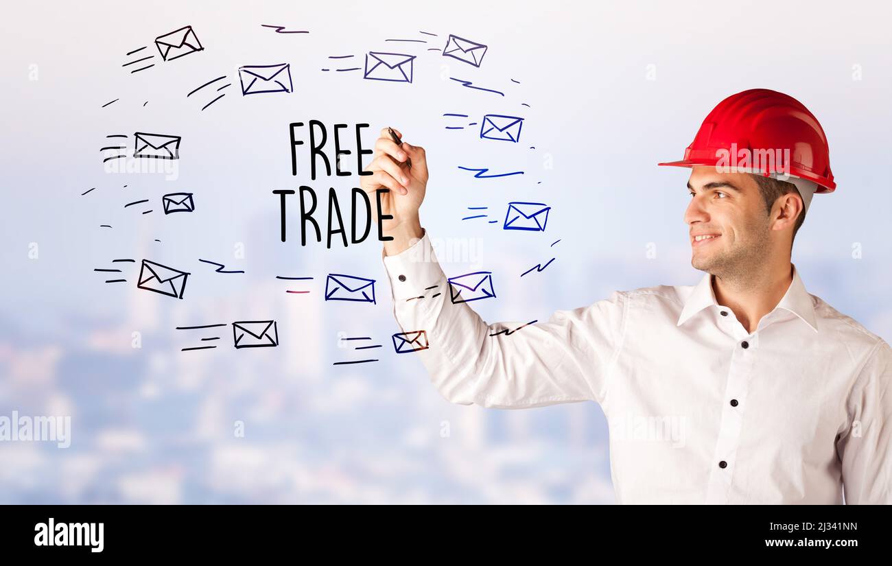 Young businessman with helmet drawing sale sign Stock Photo - Alamy