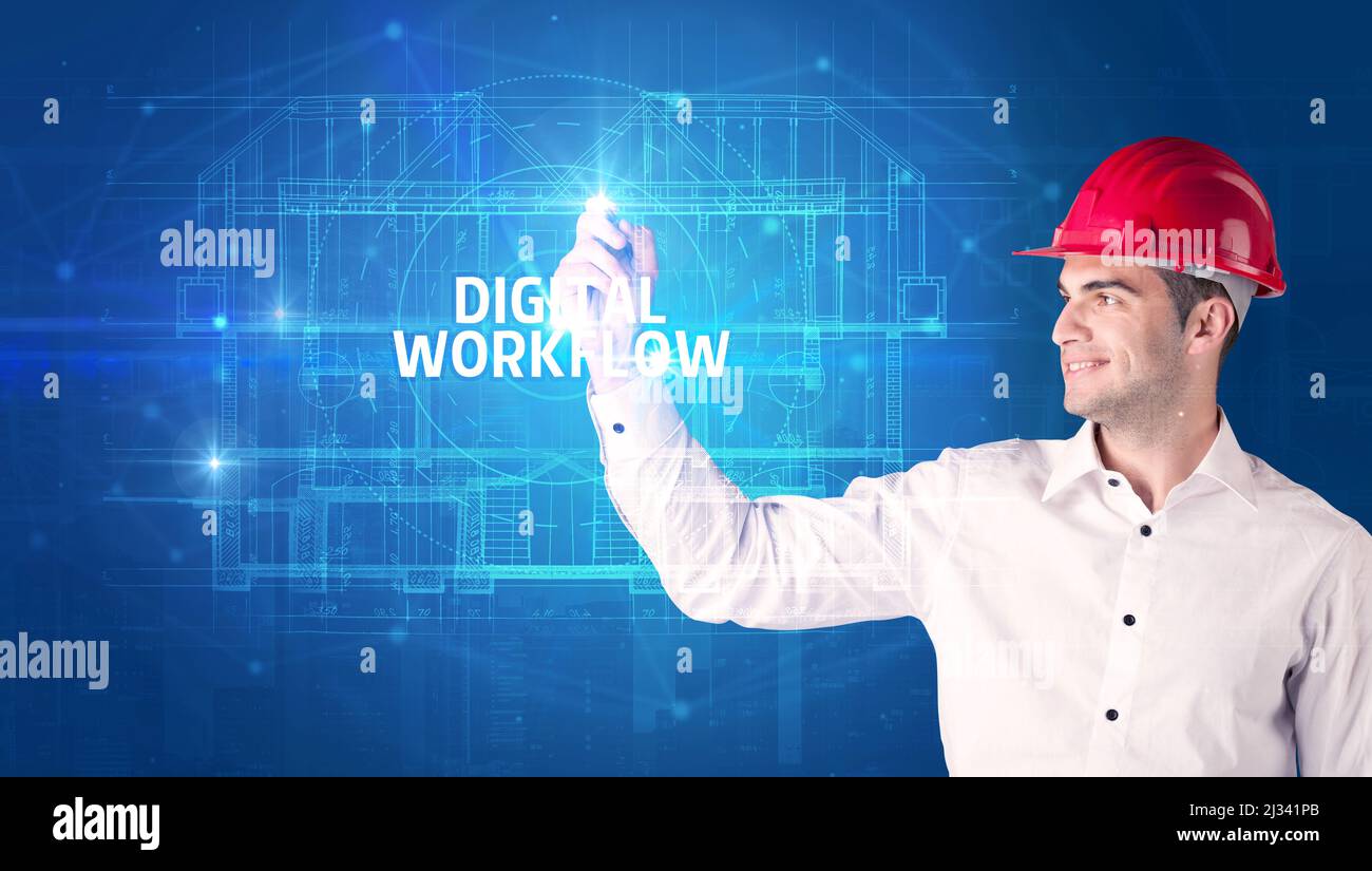 Handsome architect drawing with helmet Stock Photo - Alamy