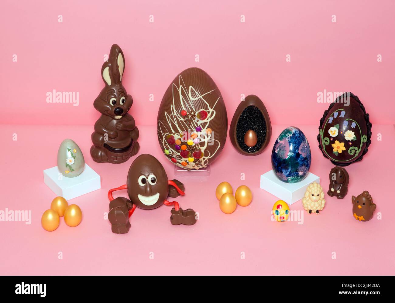 Chocolate Easter eggs on a pink background Stock Photo - Alamy