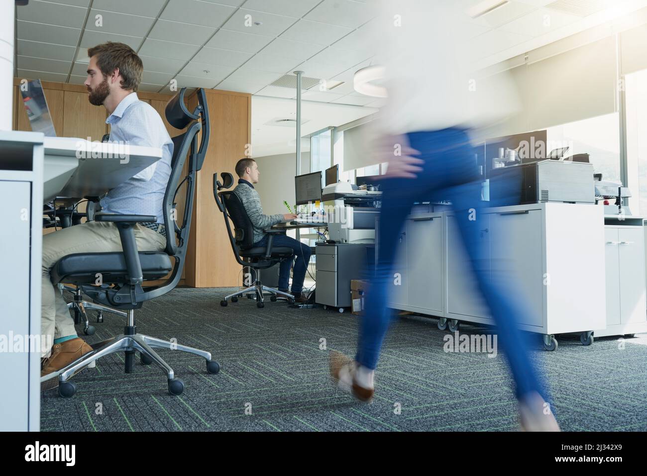 We work at a fast and effective pace. Low angle shot of a group of ...