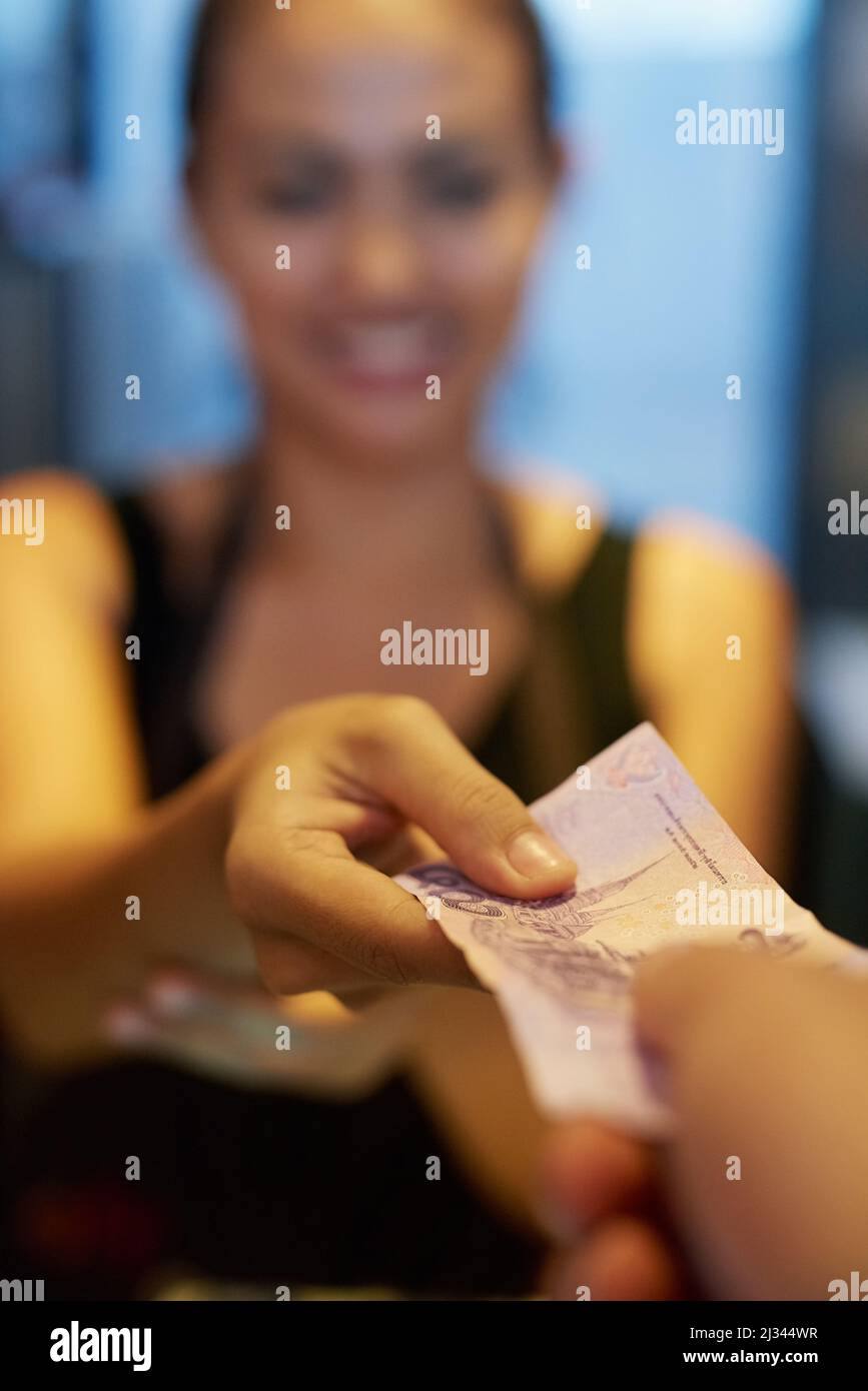 Heres your change. Cropped closeup shot of a tourist handing over money ...