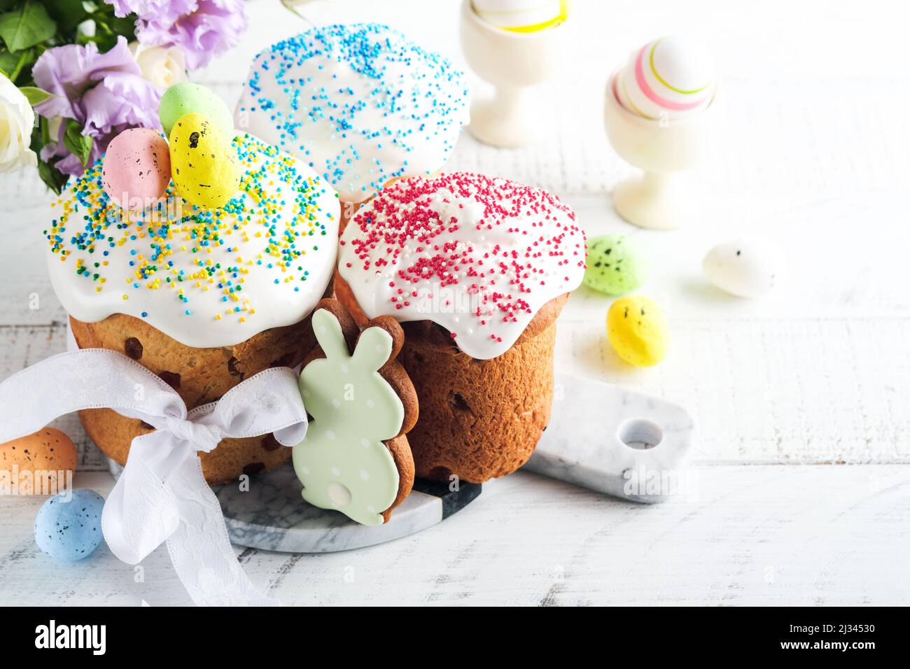 Traditional Easter sweet bread or cakes with white icing and sugar ...