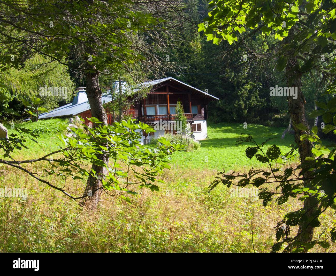 A beautiful summer day outdoors in Chamonix, France with a house ...