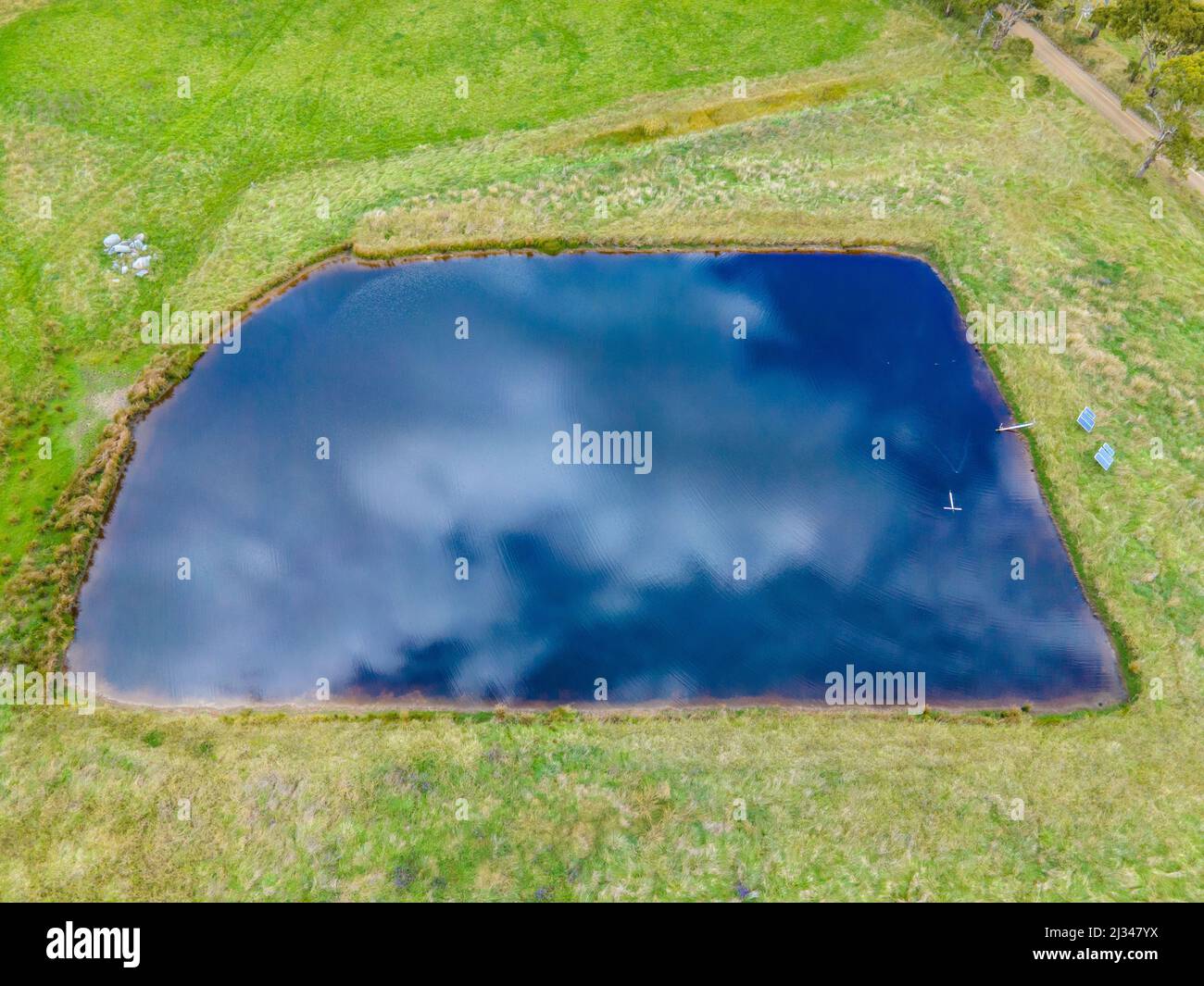 An aerial view of a small beautiful blue pond in Wellington Vale, New ...