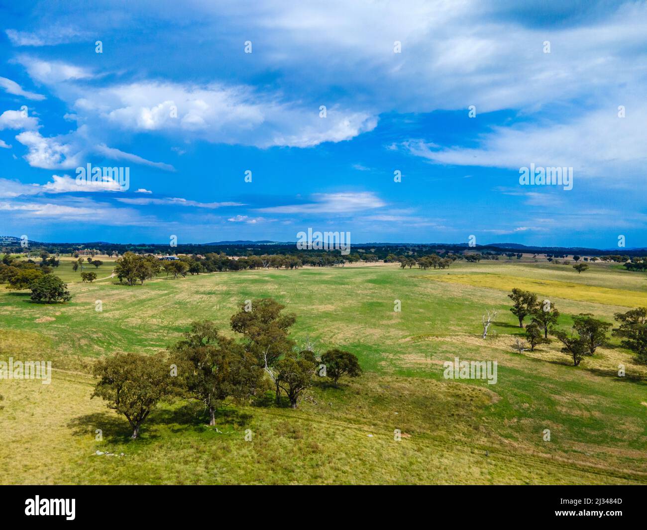 An aerial view of fields and valleys at Wellington Vale, Australia ...