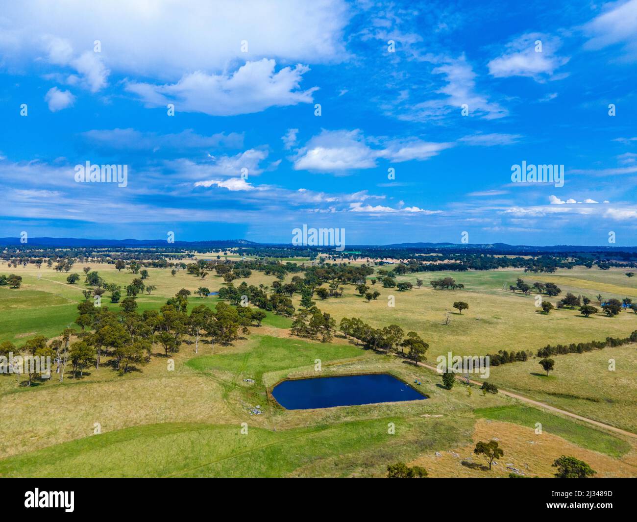 An aerial view of fields and valleys at Wellington Vale, Australia ...