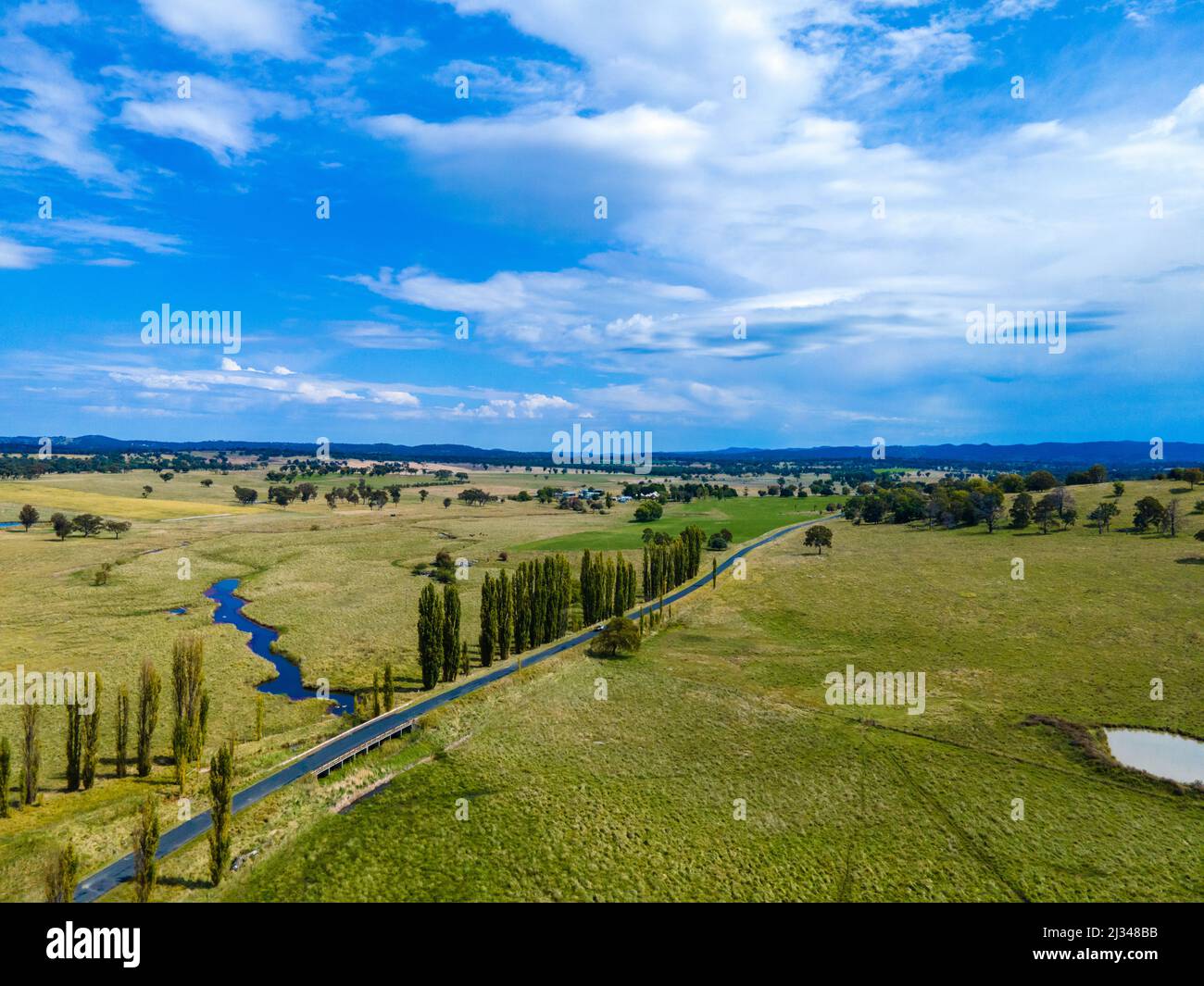 An aerial view of fields and valleys at Wellington Vale, Australia ...