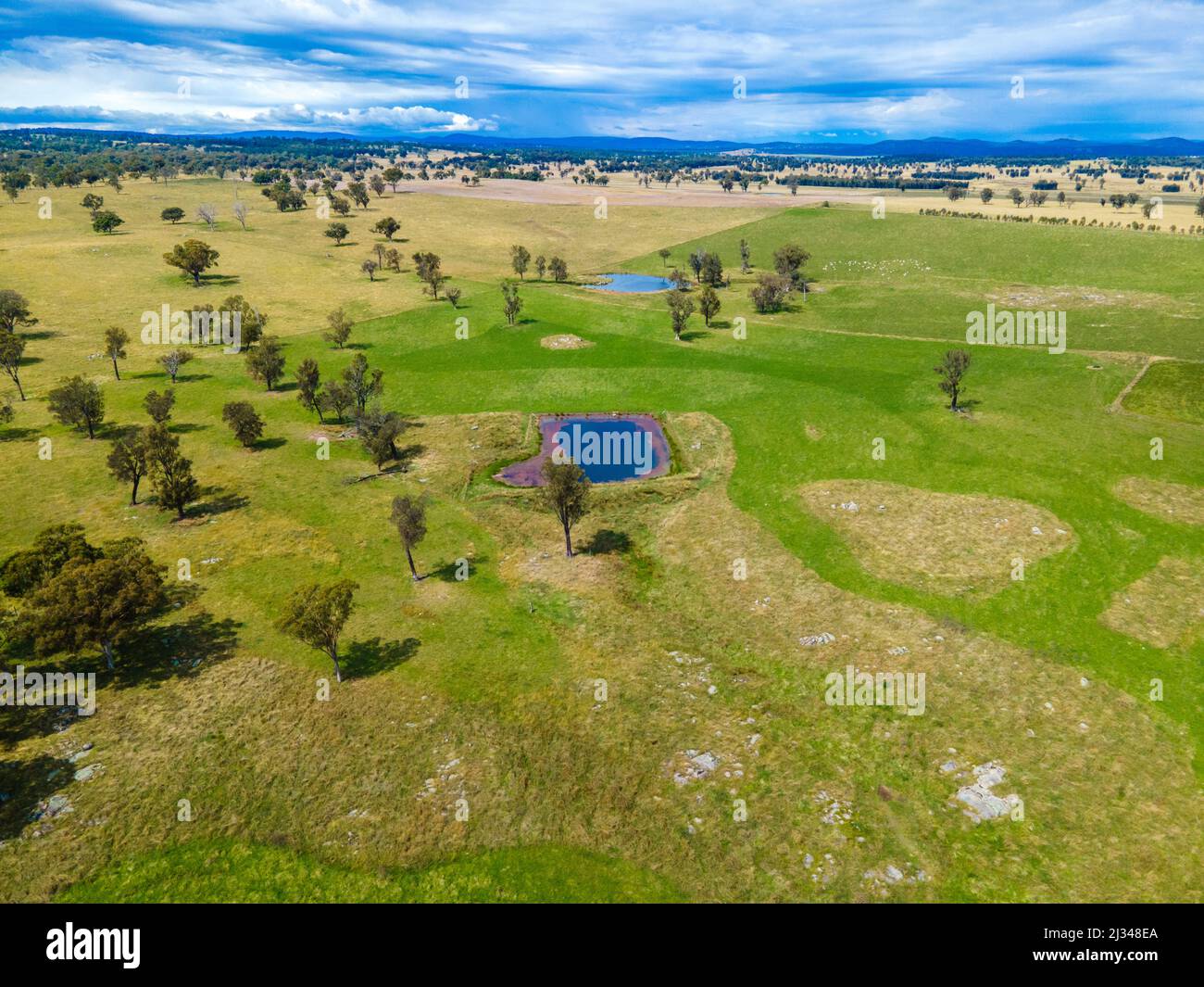 An aerial view of fields and valleys at Wellington Vale, Australia ...