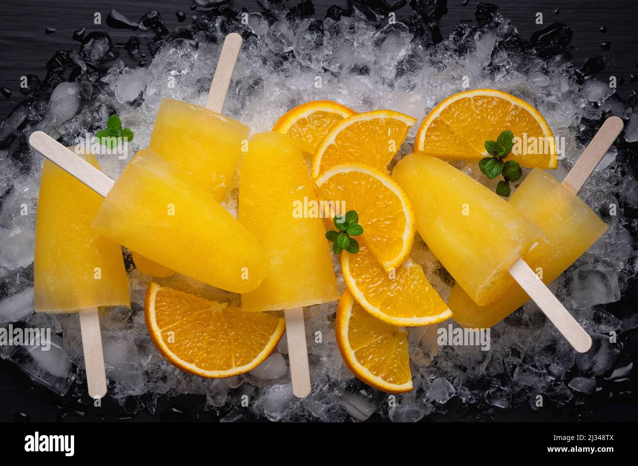 Fruit orange ice lolly and slices of orange Stock Photo - Alamy