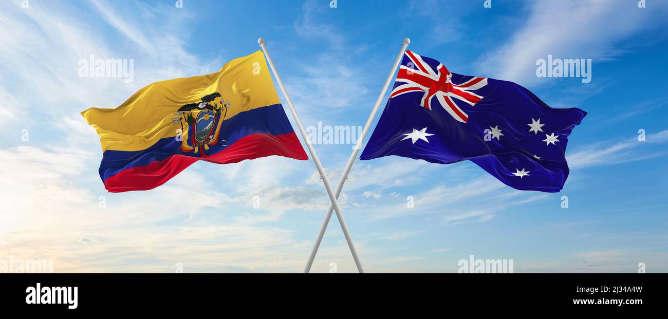 two crossed flags Ecuador and Australia waving in wind at cloudy sky ...