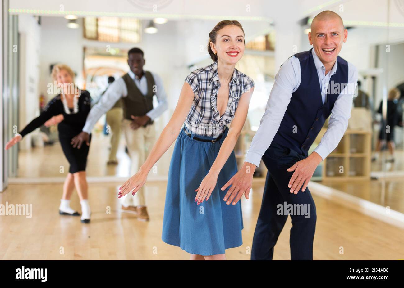 Man and woman performing jazz dance in dancing room Stock Photo - Alamy