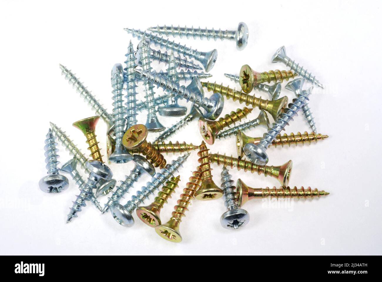 A top view of white and yellow screws on a white background Stock Photo ...