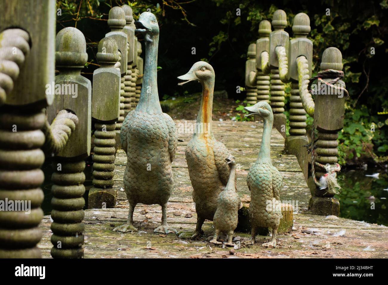 family of model ducks crosses a bridge in a typically bucolic English ...