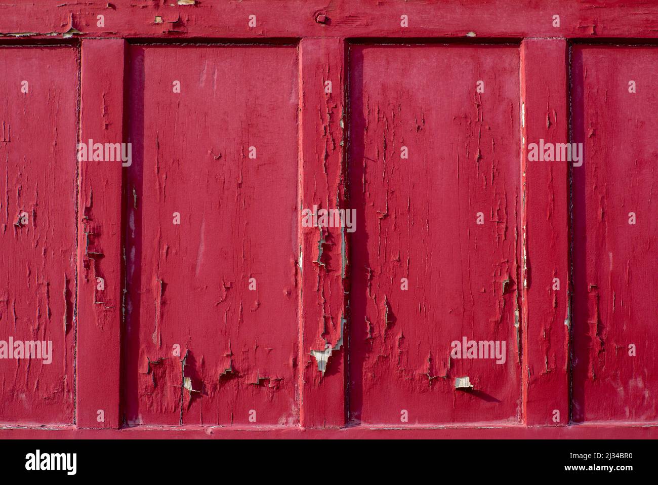 Red timber panel with paint peeling away Stock Photo - Alamy