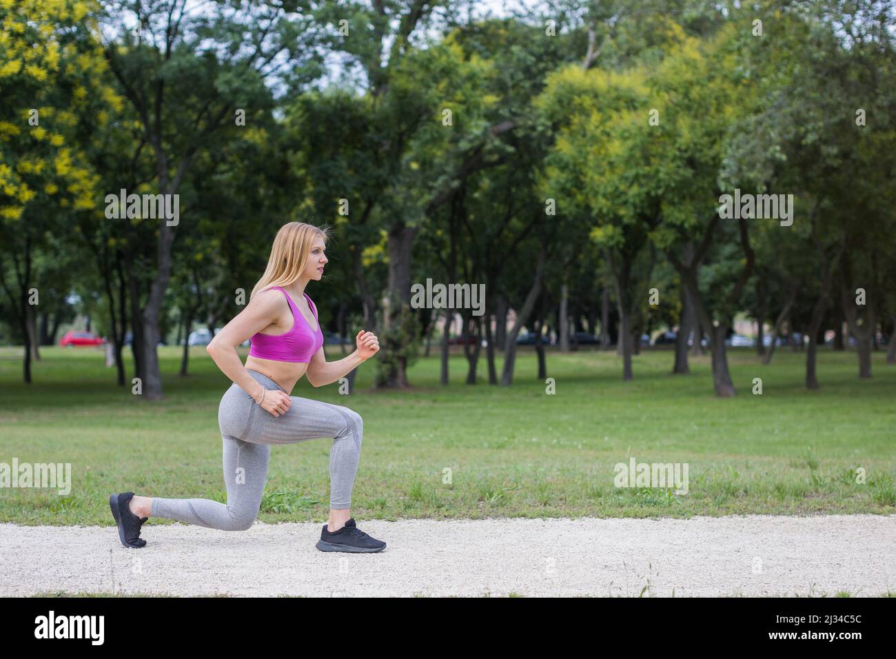 Woman exercising in park morning hi-res stock photography and images ...