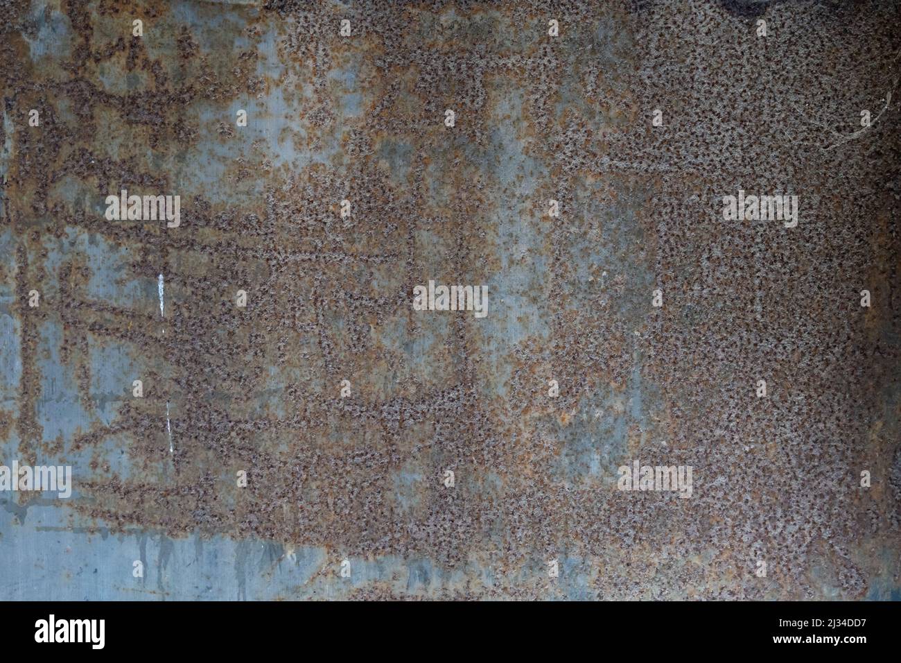 Rusty old steel surface texture as background pattern. Red spots on a ...
