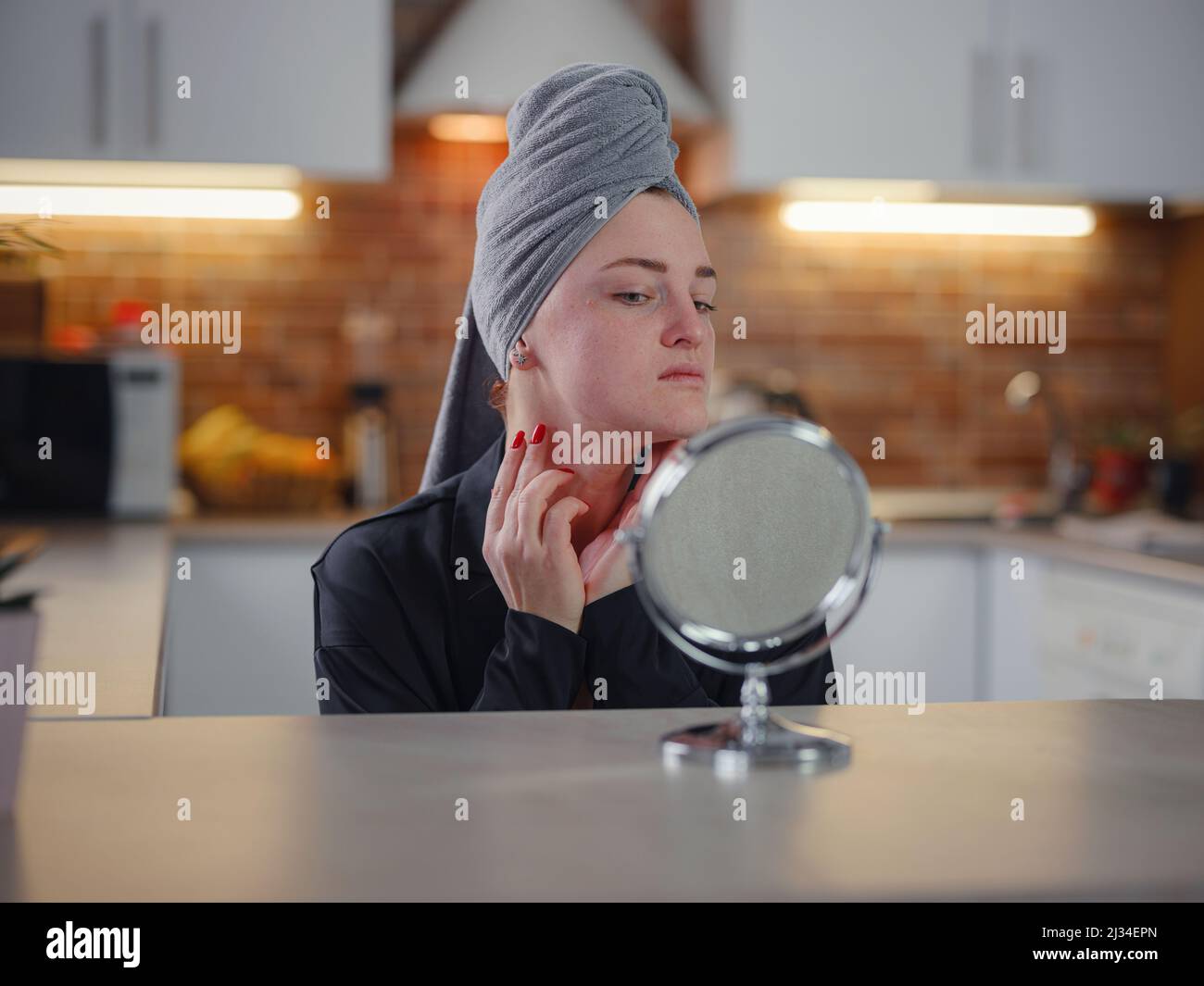 woman feeling shock while looking problem with skin condition after ...