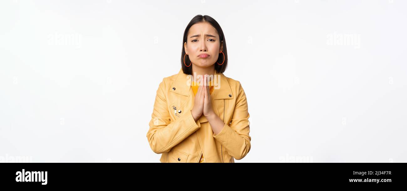 Image of hopeless asian woman begging, pleading, say sorry, looking ...