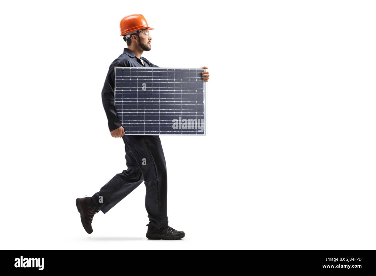 Male worker walking and carrying a solar panel isolated on white ...