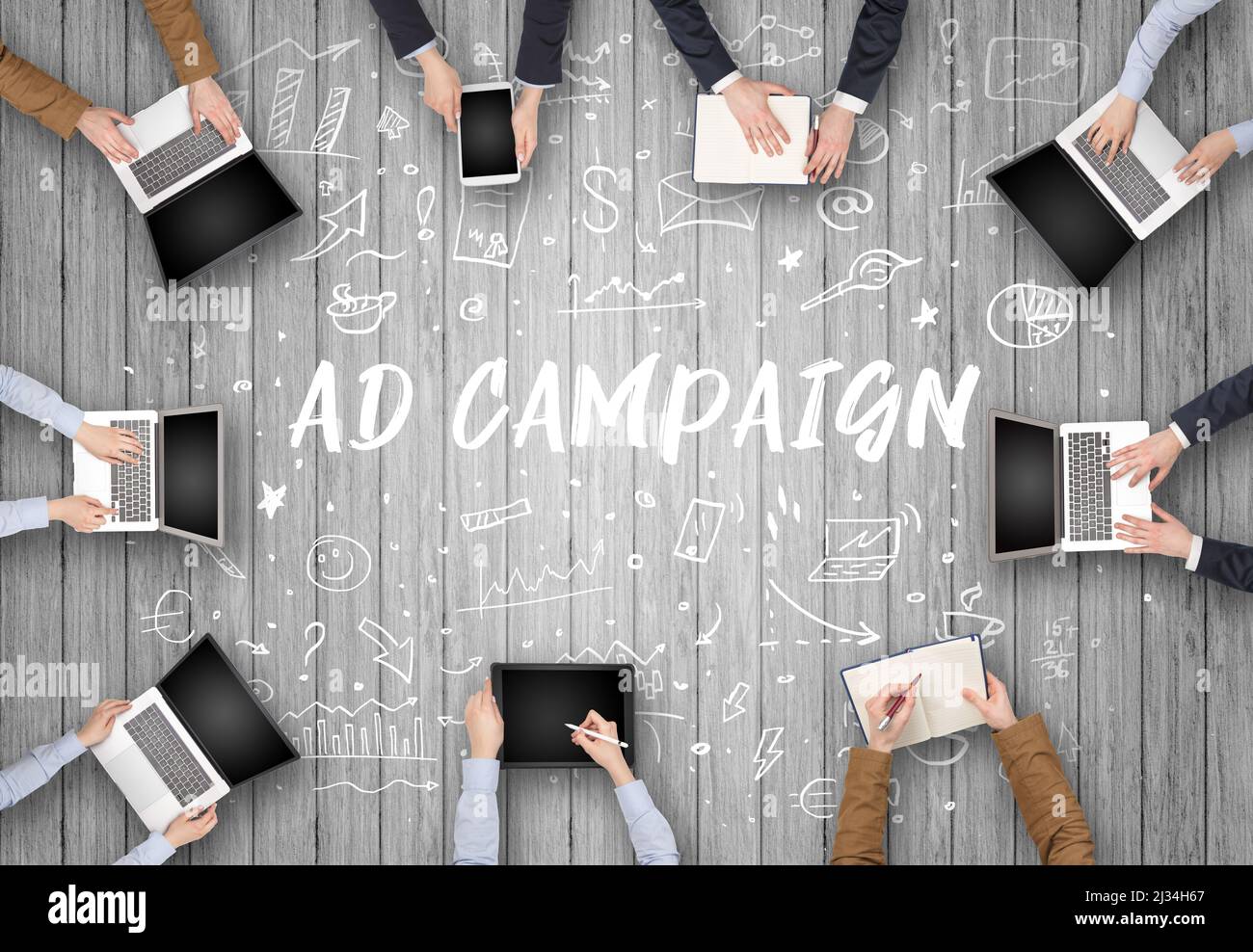 Group of business people working in office with AD CAMPAIGN inscription ...