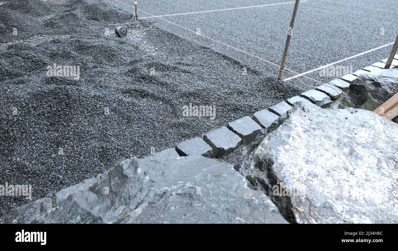 detail of building site black in black, granite, basalt and black grit ...