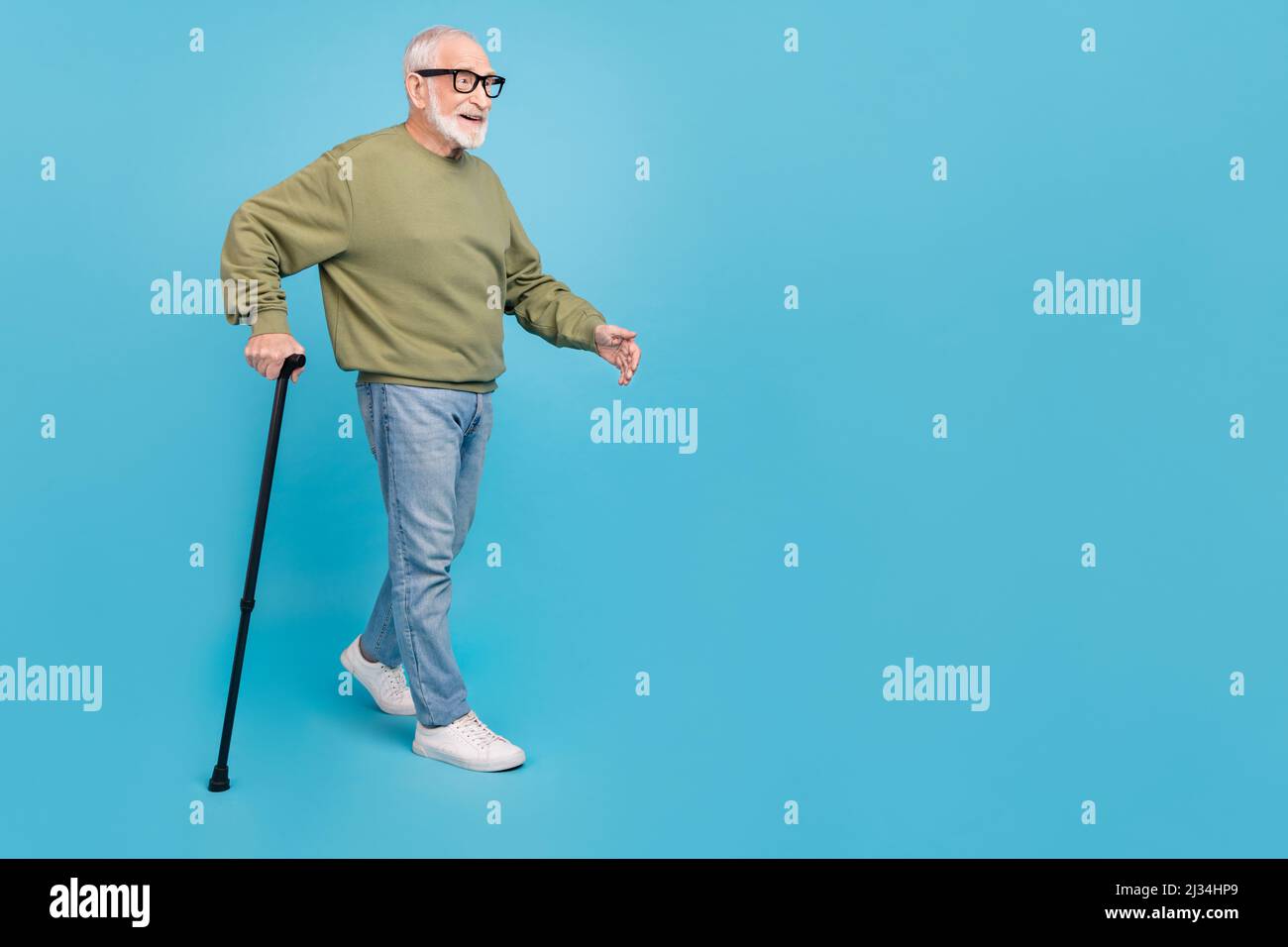 Full length body size view of attractive cheerful grey-haired man using ...