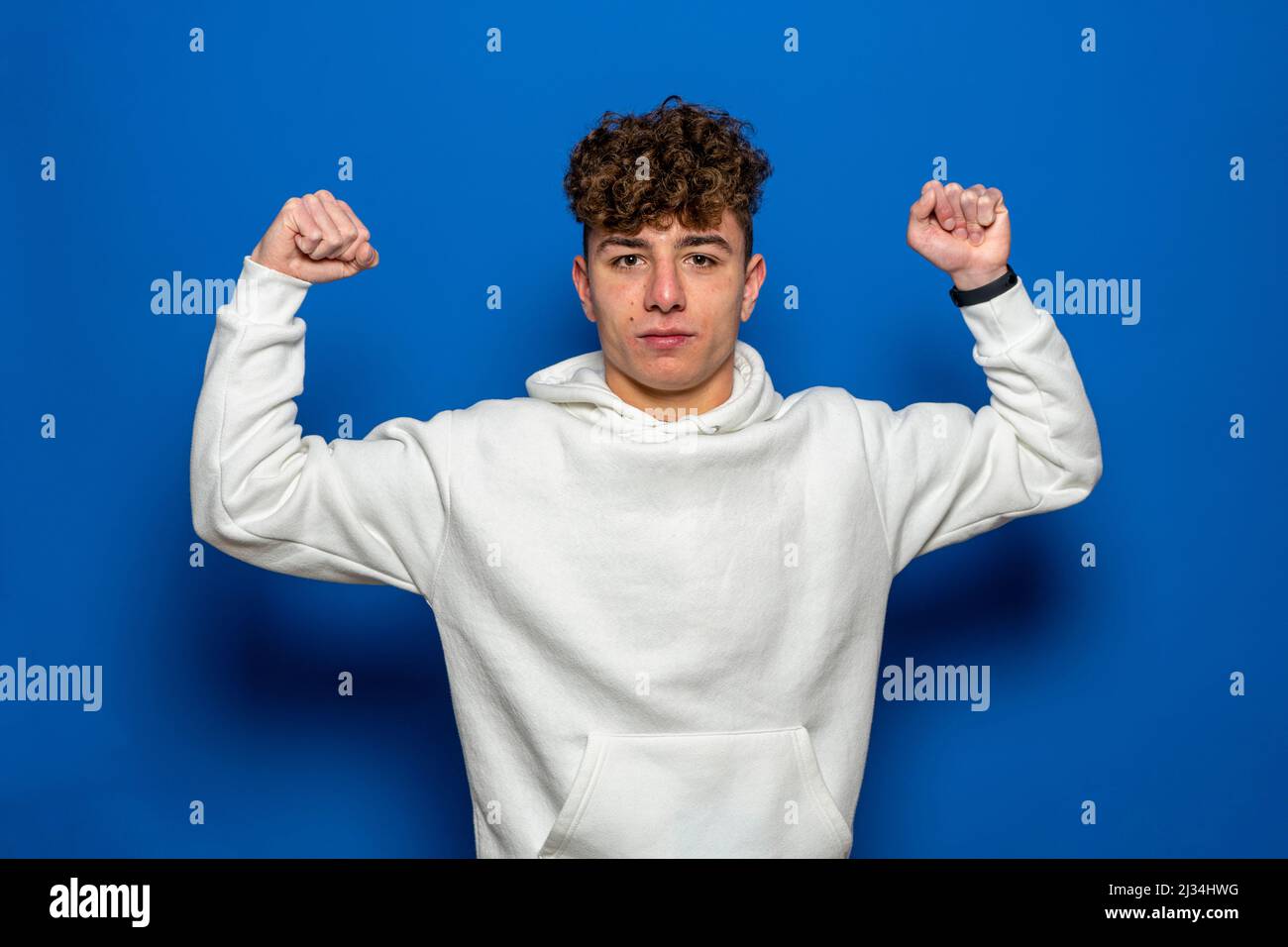Happy curly guy keeping fit and healthy lifestyle. Cheerful young ...