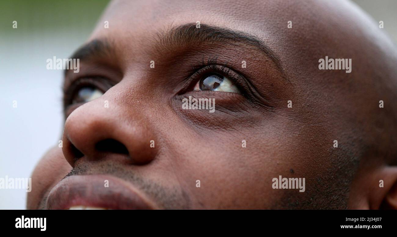 Faithful African man praying looking to sky with HOPE and FAITH Stock ...