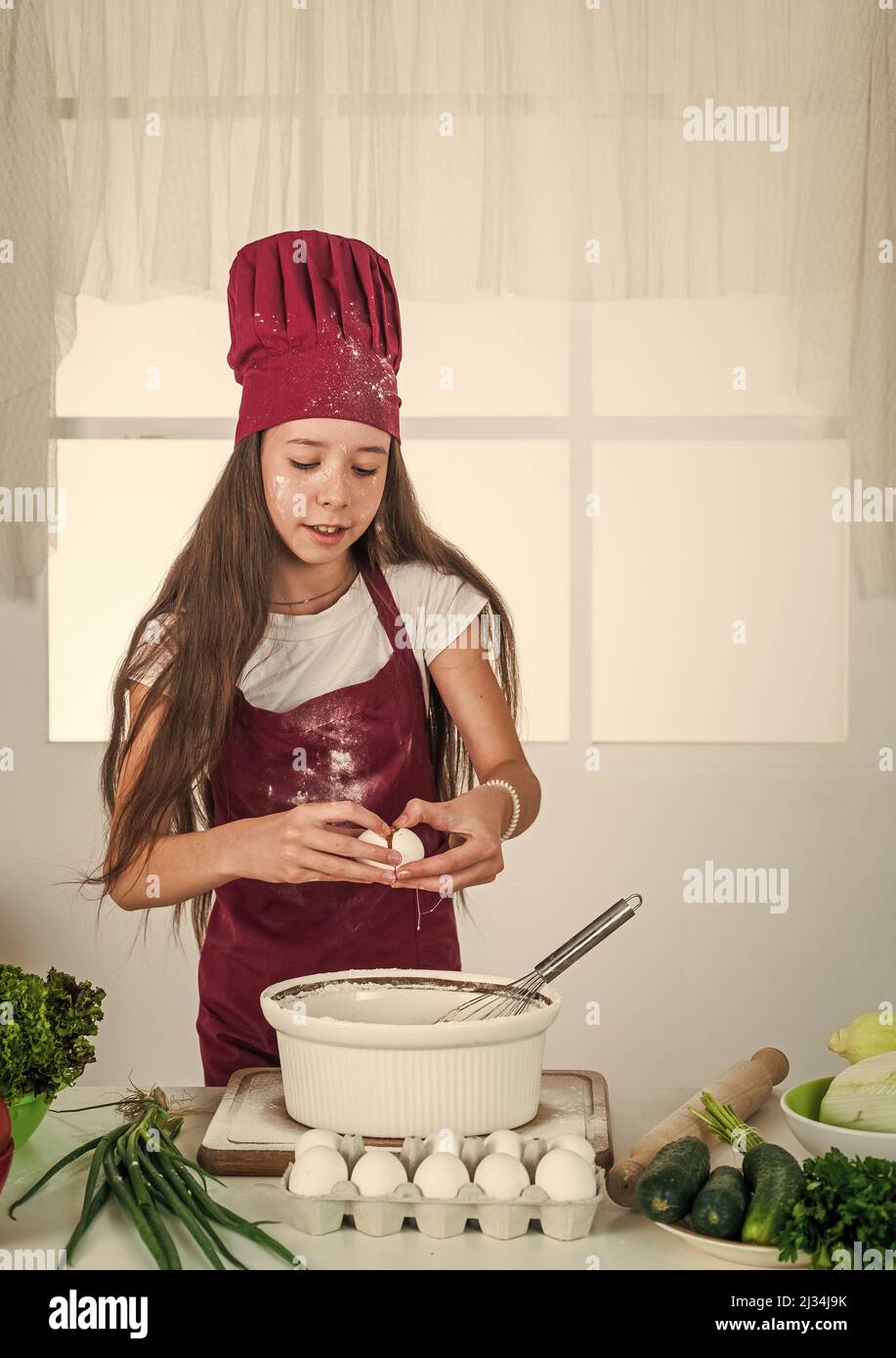 girl with flour and eggs cooking in kitchen, health Stock Photo - Alamy