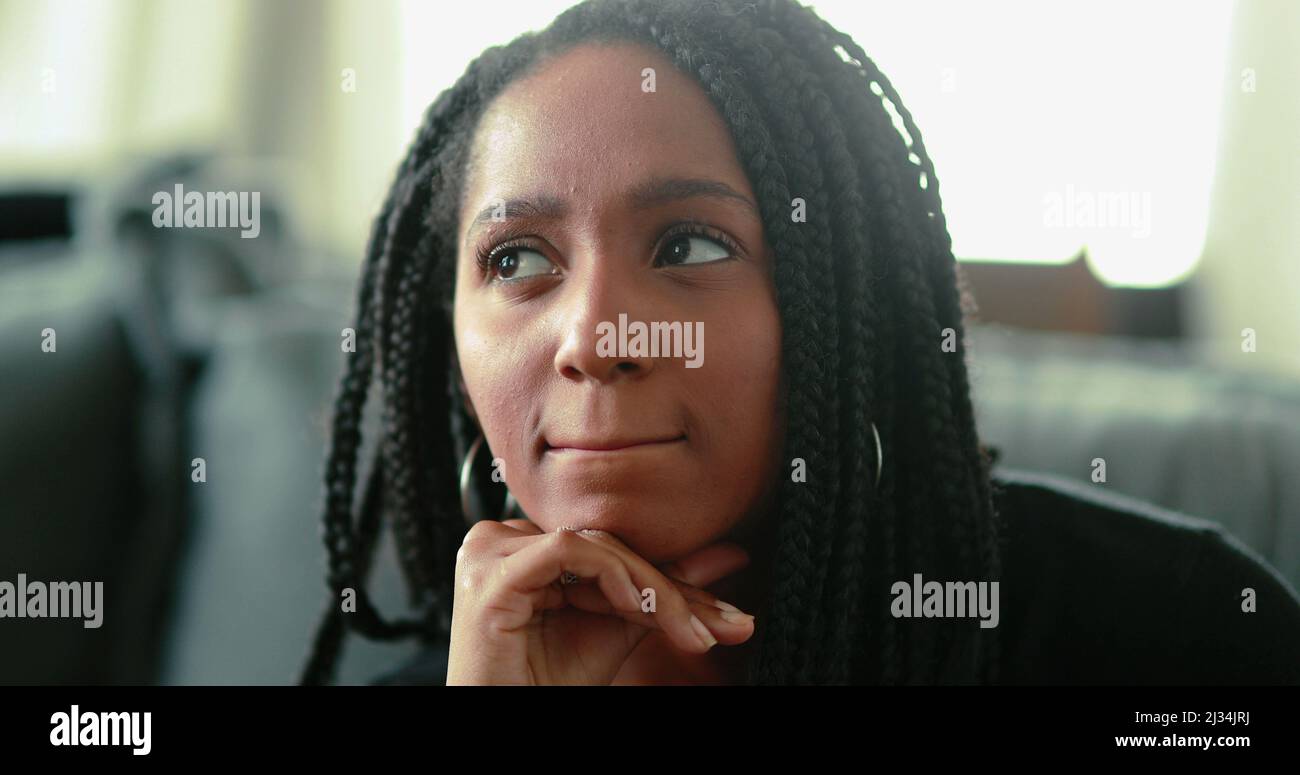 Mixed race girl thinking pondering about solution, close-up young woman ...