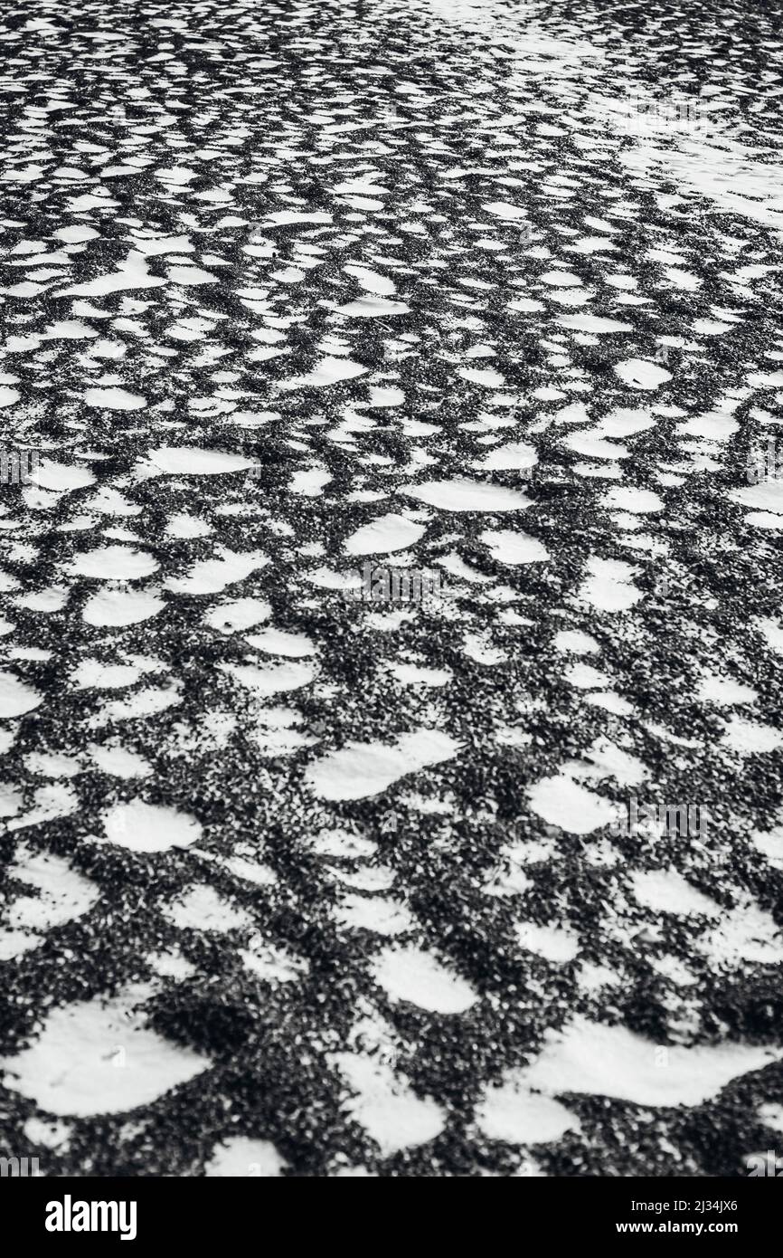 The footprints in the sand and snow Stock Photo - Alamy