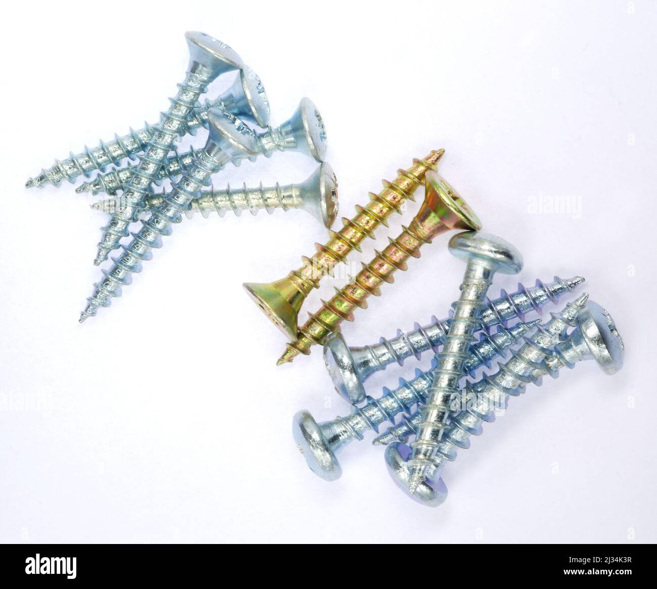 A top view of white and yellow screws on a white background Stock Photo ...