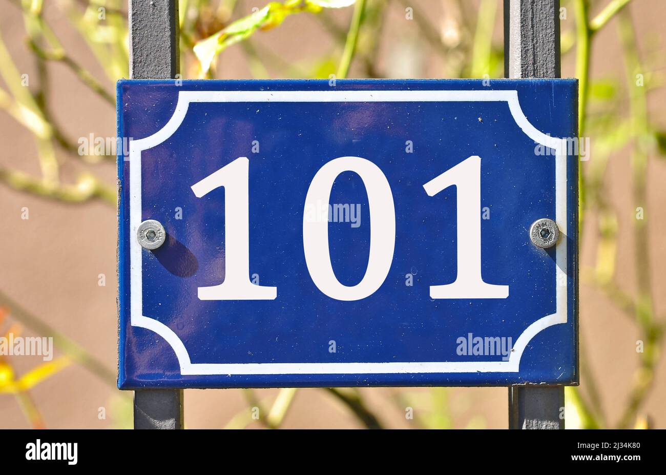 A closeup of a blue house number plaque, showing the number 101 Stock ...
