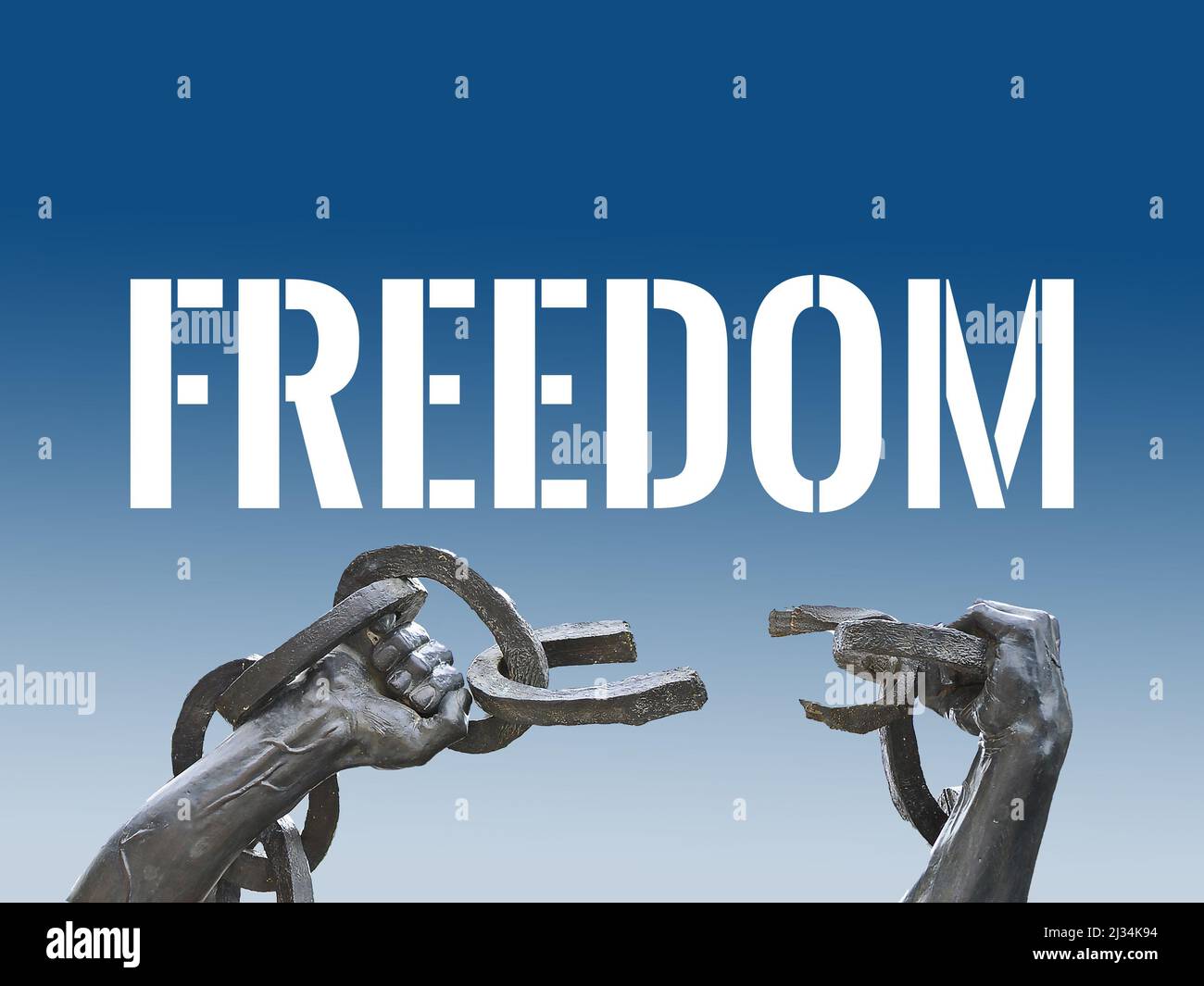 The word Freedom above freedom statue of Zambia with hands breaking ...