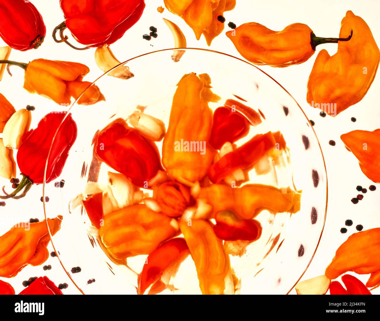 Food still life of Bonny peppers (Scotch Bonnet Peppers) on a white ...