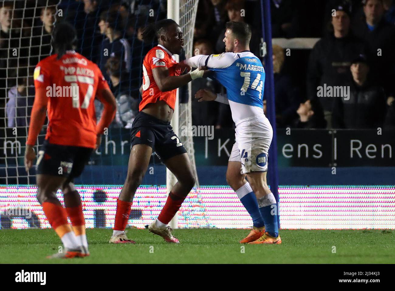 Luton Town's Peter Kioso and Peterborough United's Jack Marriott clash ...