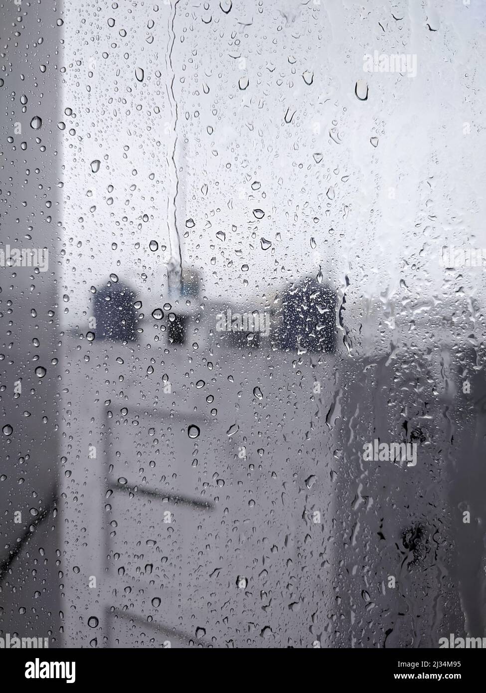 A vertical background of raindrops on the window Stock Photo - Alamy